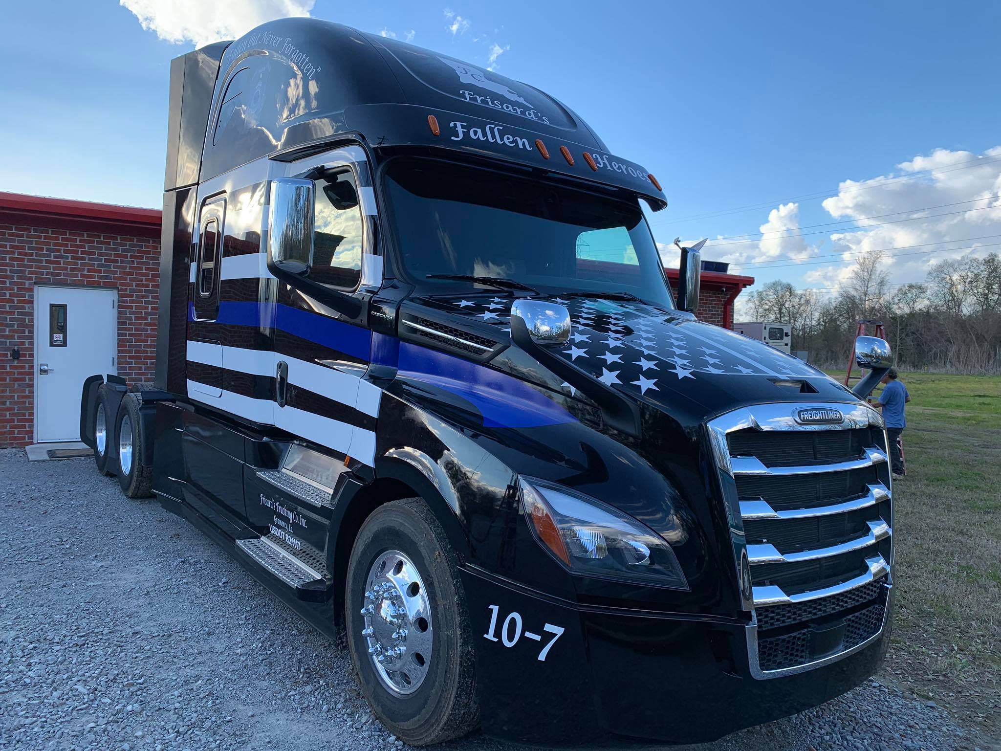 Trucking company honors fallen police officers with custom wrapped trucks