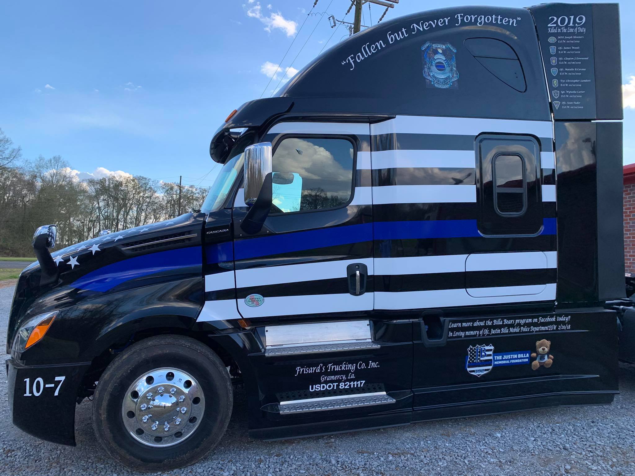 Trucking company honors fallen police officers with custom wrapped trucks